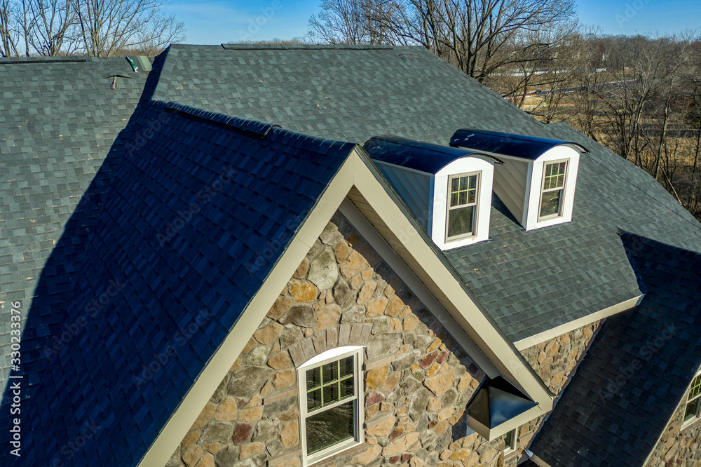 Aerial image of a new pitched roof with triangle gable covered by ...