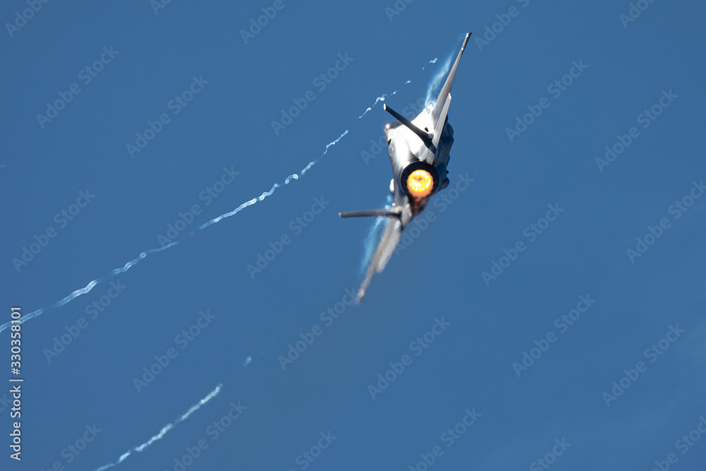 F-35 Lightning II in a tight turn, with afterburner on and condensation ...
