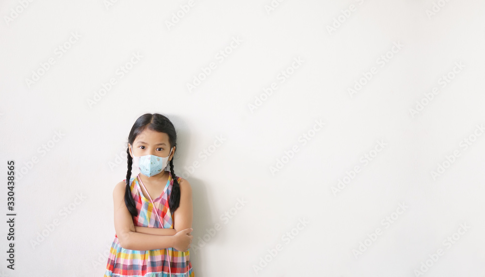Asian child or kid girl wear N95 paper face mask for close mouth and ...