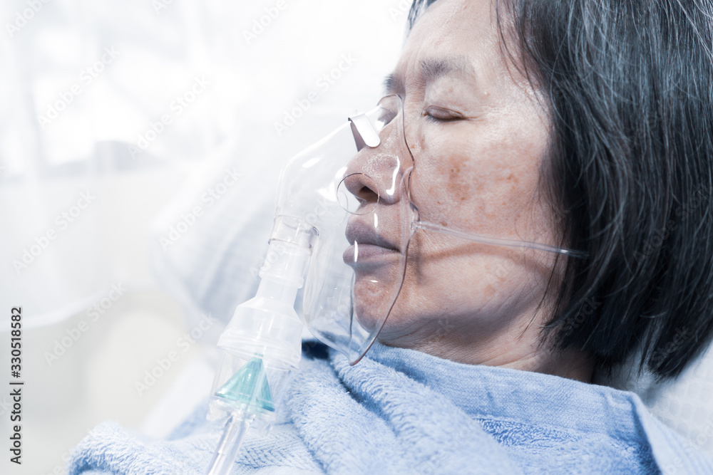 An old asian patient having viral pneumonia were treated with oxygen ...