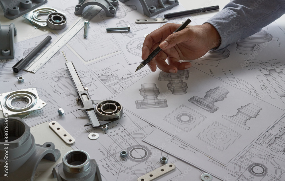 Engineer technician designing drawings mechanical parts engineering ...