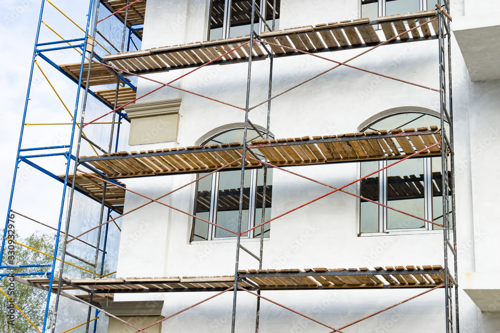 Extensive scaffolding for building a new house. Constraction of ...