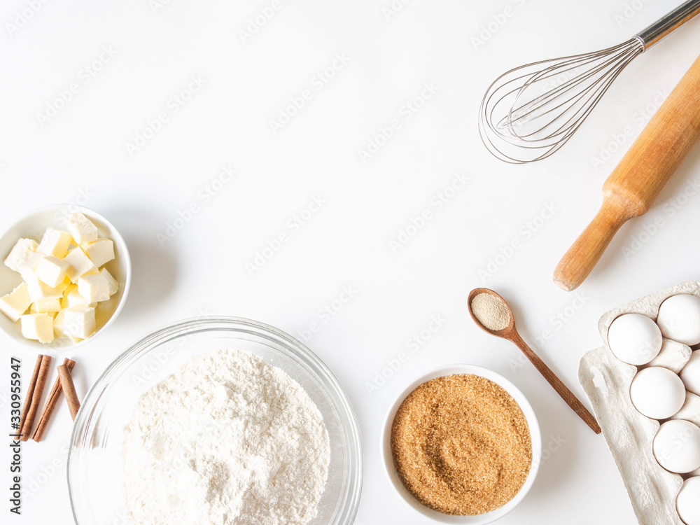 Frame of various baking ingredients - flour, eggs, sugar, butter, dry ...