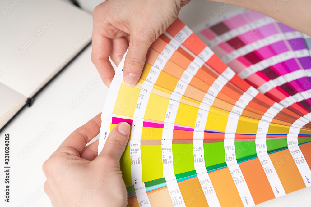 Graphic designer at work chooses color palette Stock Photo | Adobe Stock
