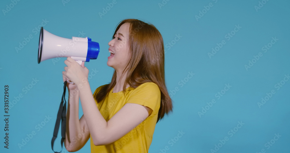 Speaking Loud noise announce of young asian woman with megaphone in ...