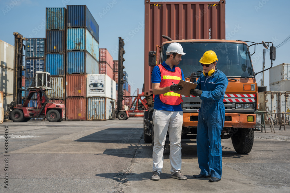 Foreman and dock worker staff working checking at Container cargo ...