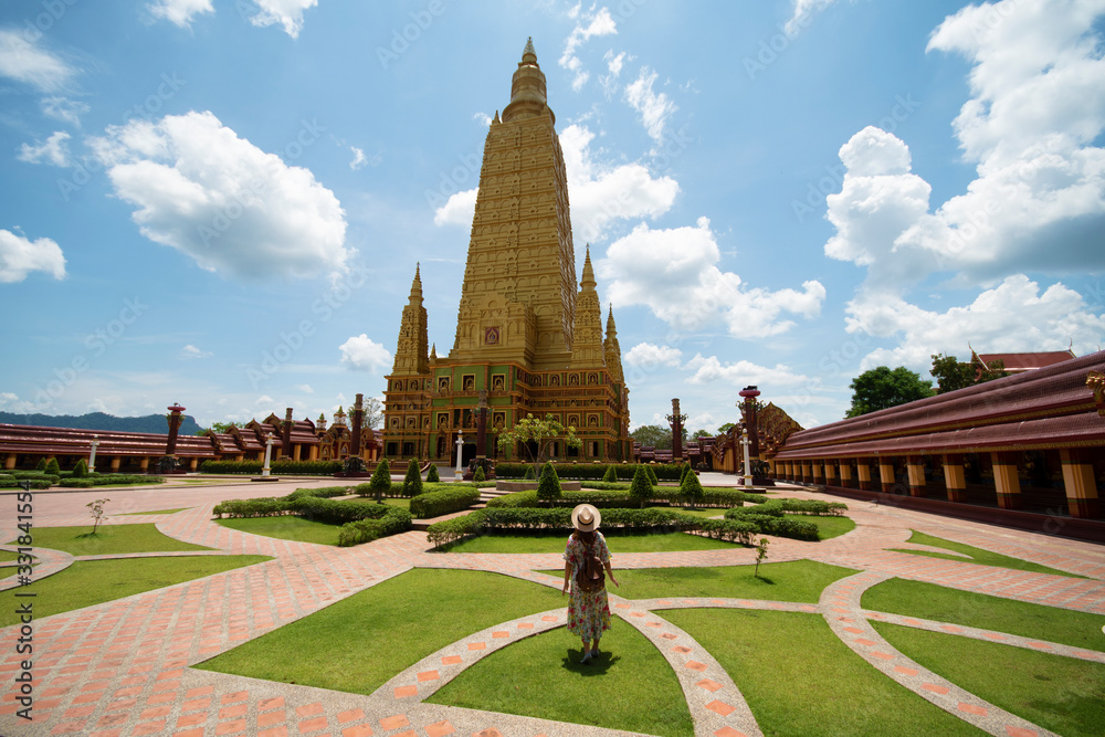 Female tourist is sightseeing at Golden Pagoda at Wat Bang Thong or Wat ...