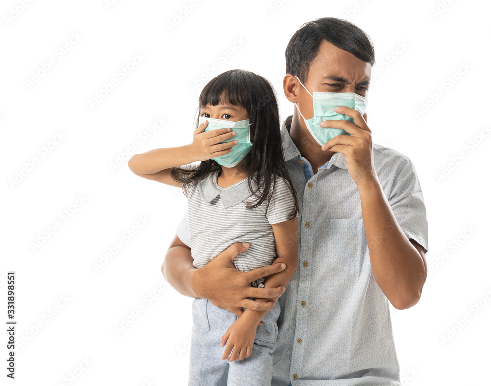 virus pandemic. father and daughter wearing face masks coughing ...
