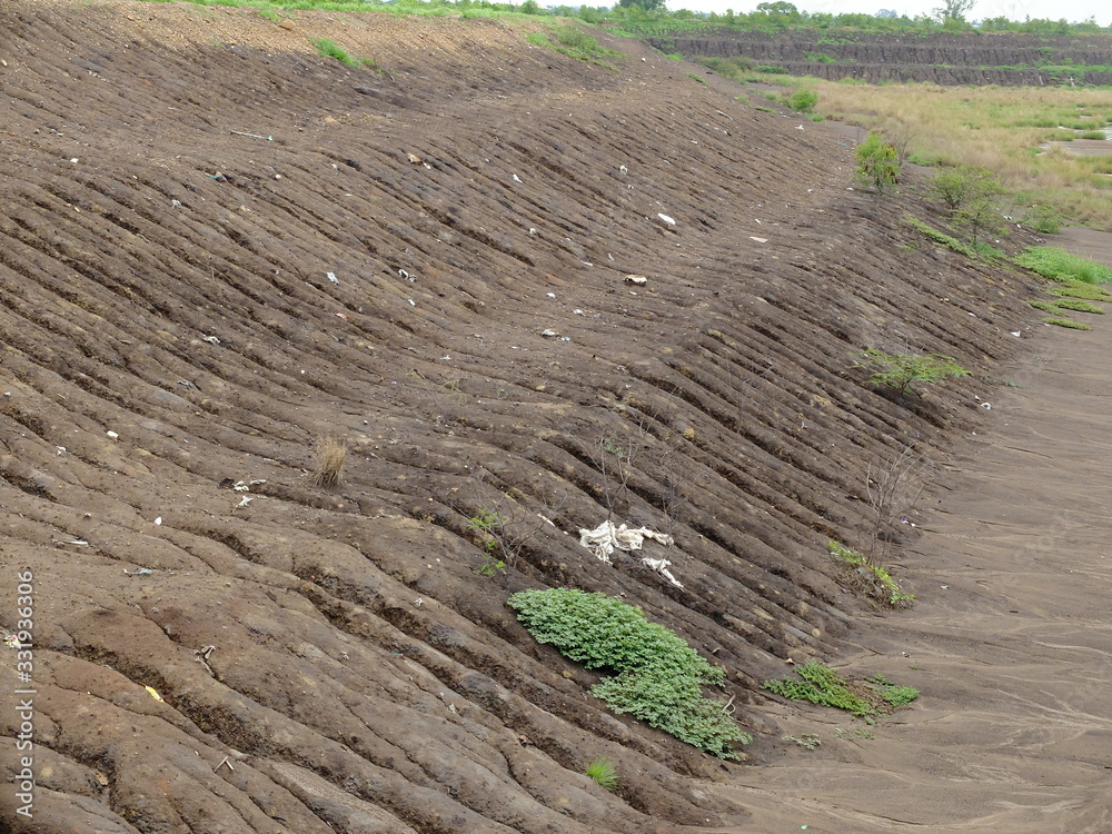 Soil erosion in waste landfill site in Thailand Stock Photo | Adobe Stock