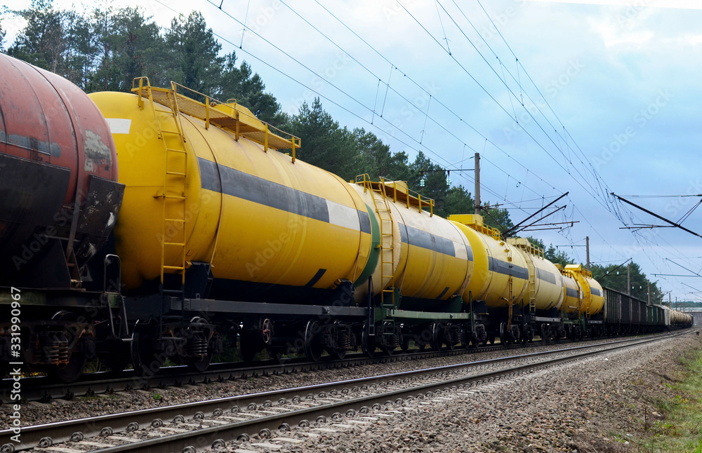 Foto de Stock Freight train with petroleum tank cars on railroad. Rail ...