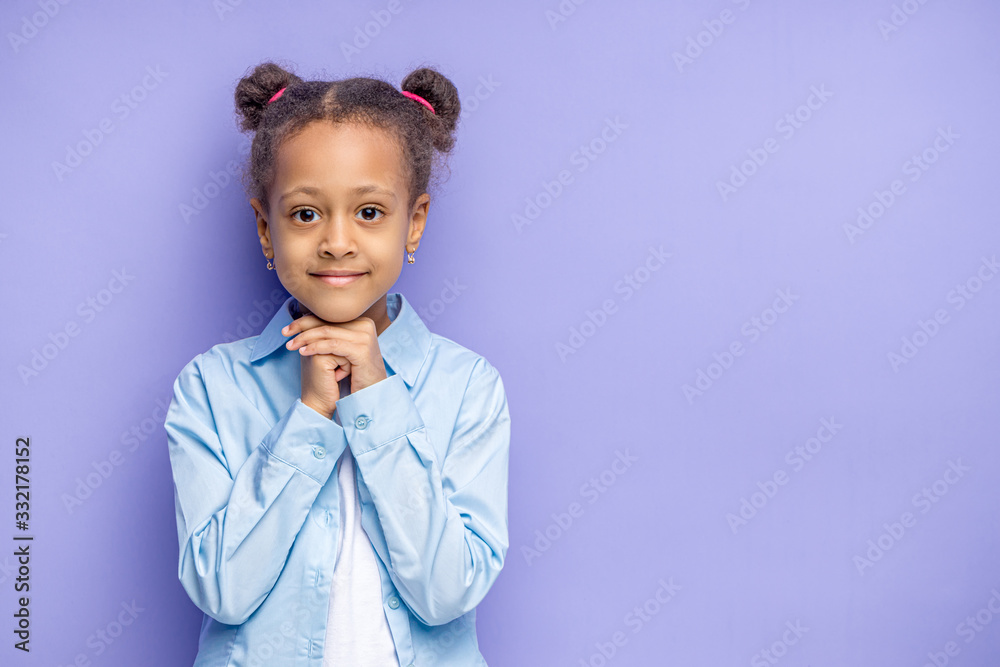 portrait of cute or african kid girl isolated over purple background ...