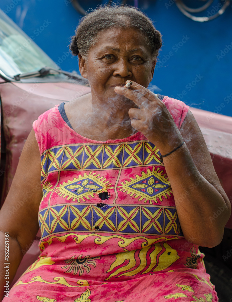 mator lady looking homeless indigenous, smoked with sad face and blue ...