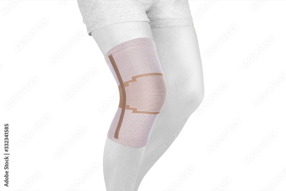 Knee Support Brace on leg isolated on white background. Orthopedic ...