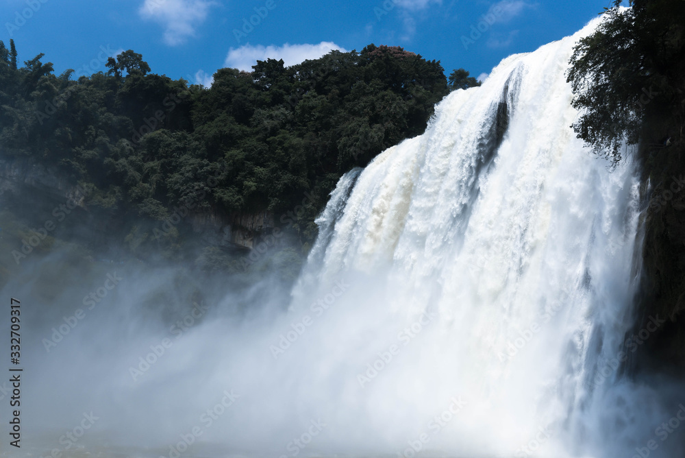 Traveler sightseeing landmark of Huangguoshu Waterfall, the largest ...