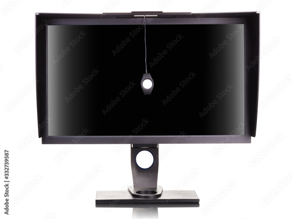 Professional monitor with shading hood and calibrator isolated on white ...