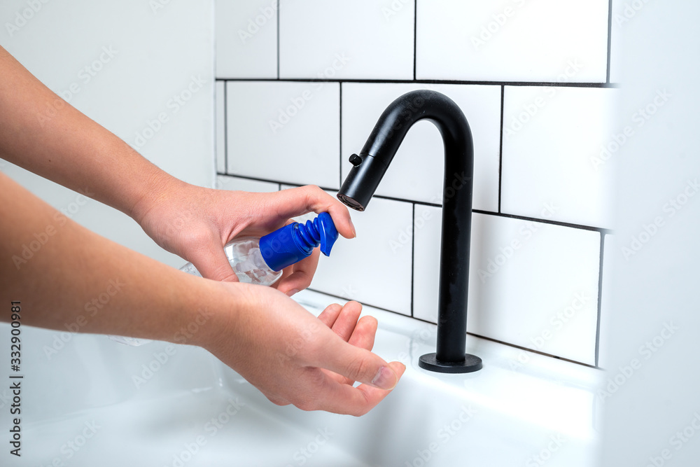 Applying disinfectant hand gel to protect against bacteria and viruses ...
