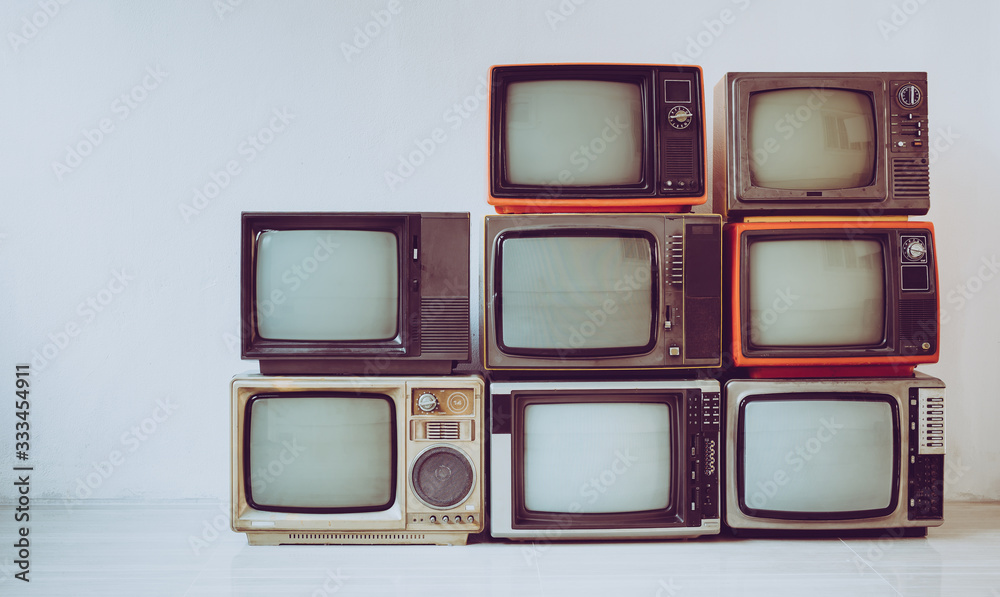 Pile of old retro television in room, vintage filter effect Stock Photo ...