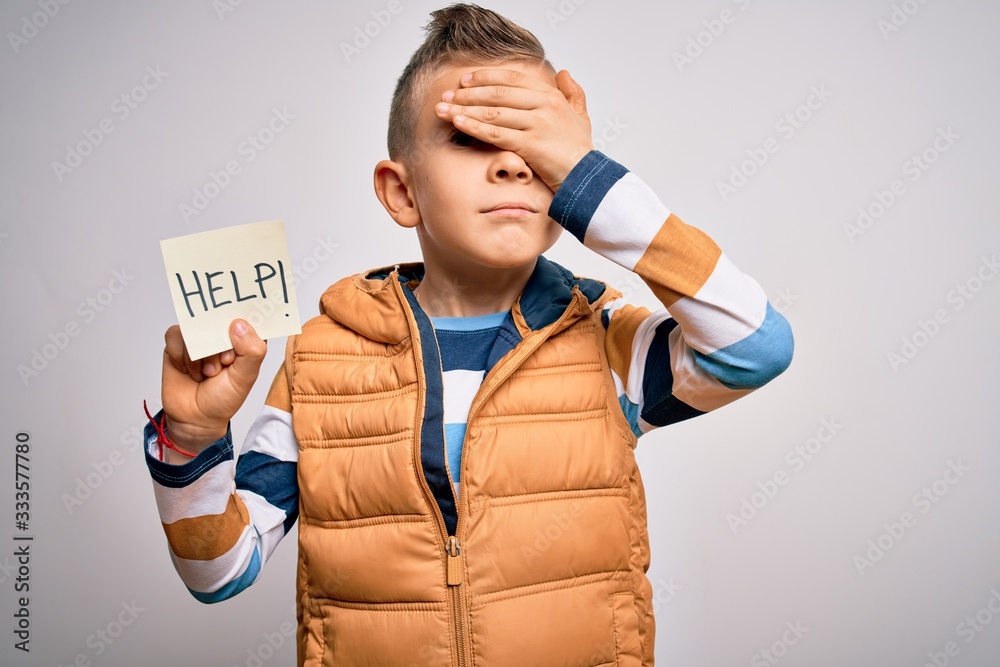 Young little caucasian kid asking for help on a paper note as violence ...