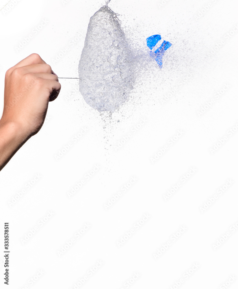 water balloon exploding over a white background Stock Photo | Adobe Stock