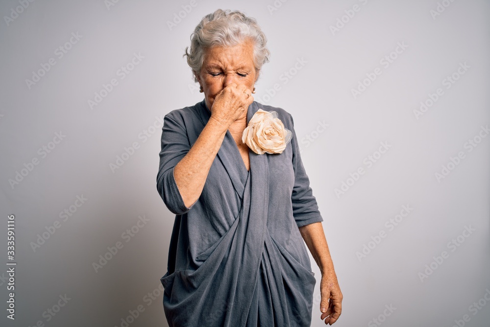 Senior beautiful grey-haired woman wearing casual dress standing over ...