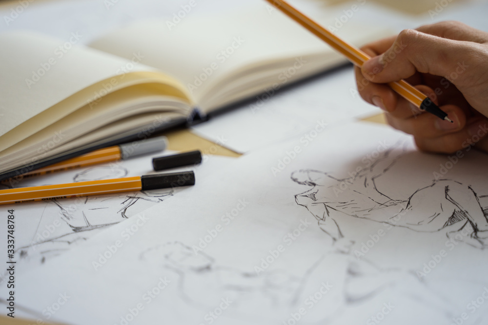 Figure drawing, sketching class. Male hands draw. Stock Photo | Adobe Stock