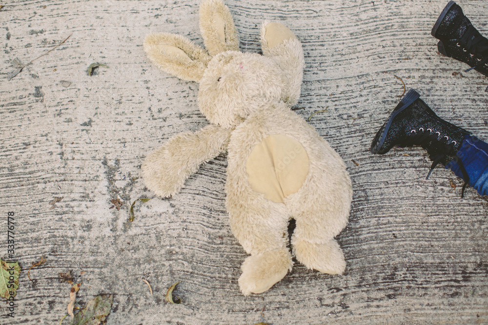 Toy Rabbit and Child's Feet Stock Photo | Adobe Stock