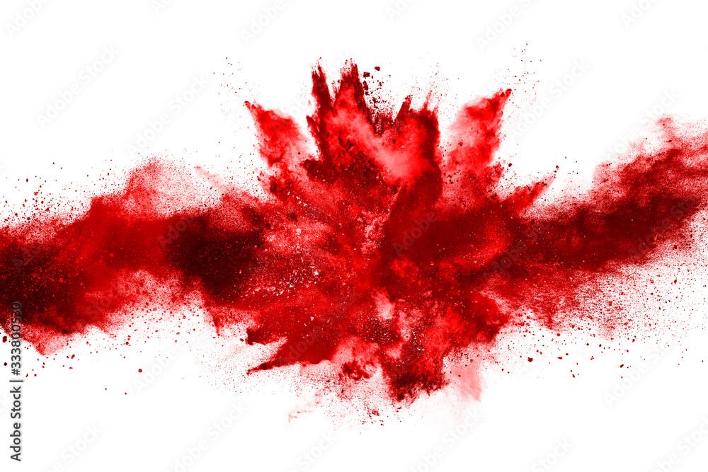 Freeze motion of red powder exploding, isolated on white background ...