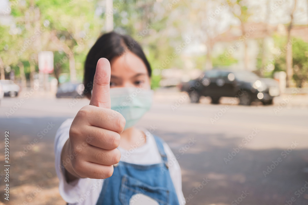 Coronavirus Covid-19 and the PM2.5 Air Pollution Concept. Asian girls wearing masks to protect ...