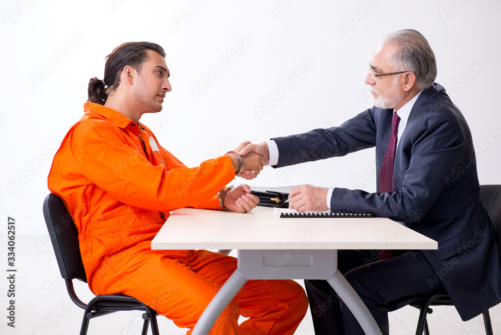 Young captive meeting with advocate in pre-trial detention Stock Photo ...