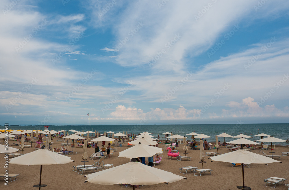 Umbrellas on the beach of Lignano Sabbiadoro, one of the most famous ...