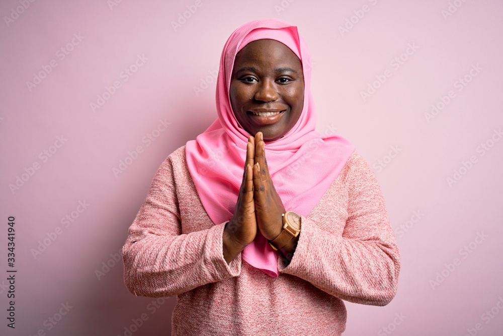 Young african american plus size woman wearing muslim hijab over ...