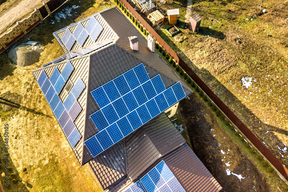Aerial top view of new modern residential house cottage with blue shiny ...
