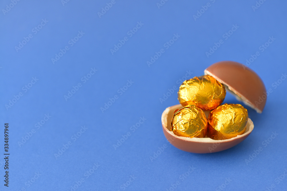 Sweet chocolate eggs on color background Stock Photo | Adobe Stock