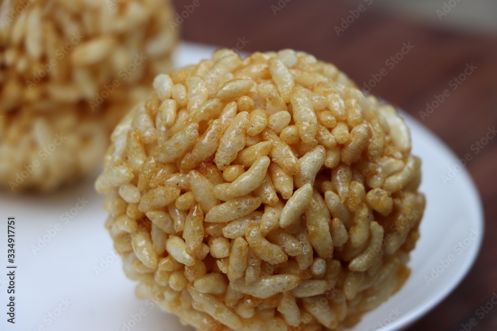 Indian Traditional Puffed Rice Balls is a sweet made using puffed rice ...