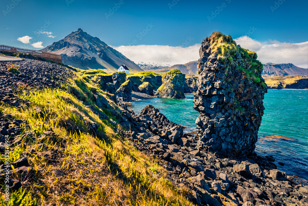 Amazingly shaped basalt columns on the shores of Atlantic Ocean. Sunny ...