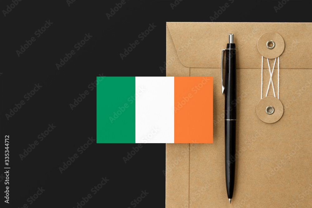 Ireland flag on craft envelope letter and black pen background ...