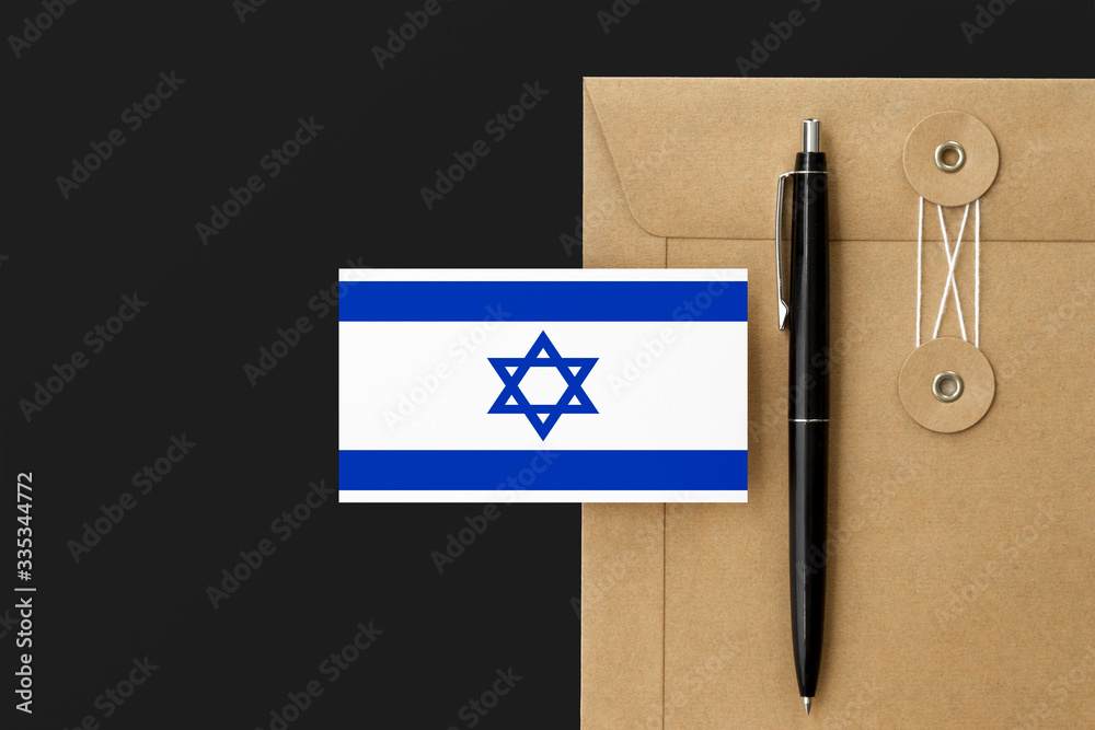 Israel flag on craft envelope letter and black pen background. National ...