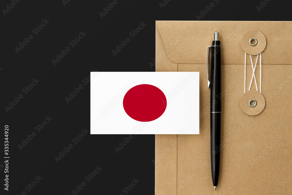 Japan flag on craft envelope letter and black pen background. National ...