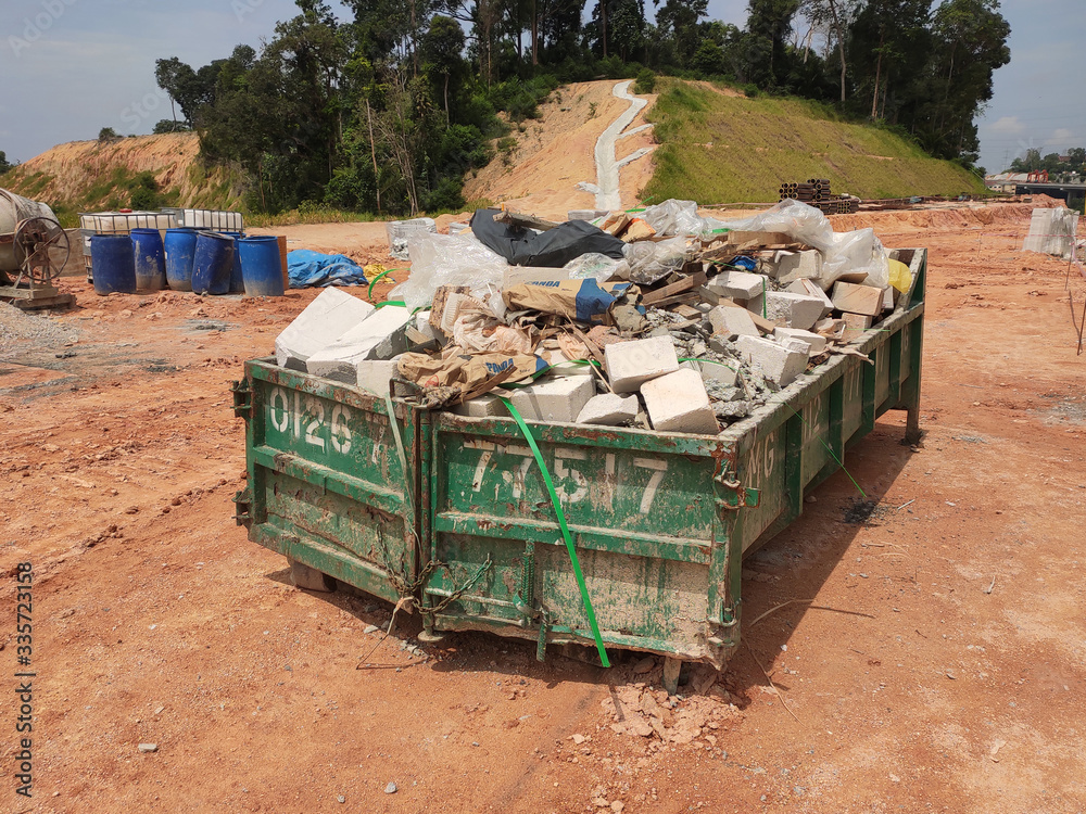 Huge wasted disposal bin used to collect rubbish and unused material ...