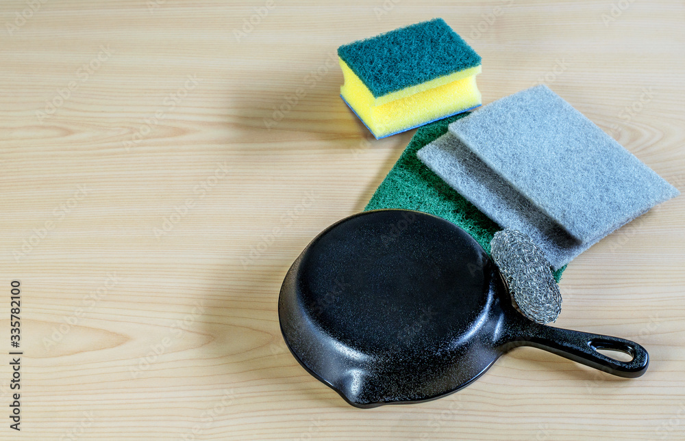 Cleaning items, brushes for clean kitchenware on the wooden background ...