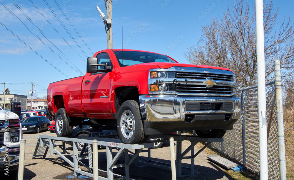 Chevrolet 2500 HD red truck. Stock Photo | Adobe Stock