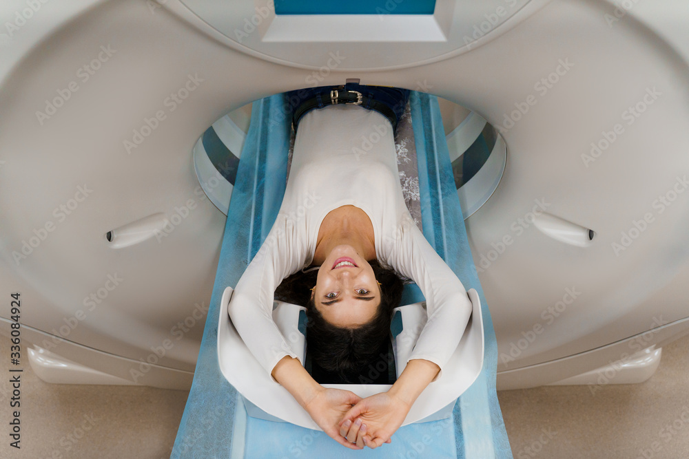 CT scan of the brain and skull for a smiley young girl to treat a ...