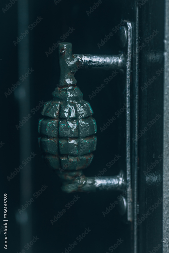 Grenade. Hand grenade door handle. Military art Stock Photo | Adobe Stock