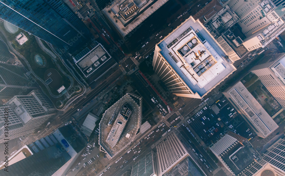 Top view of modern cityscape of rooftops and buildings in business and ...