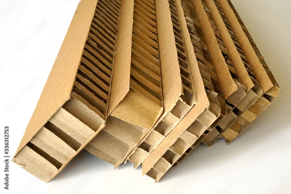 Sheets of brown corrugated cardboard used for filling in fragile ...