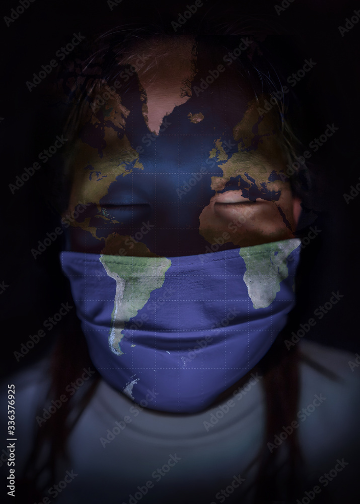 Teenage boy with face mask and face painted with world map Stock Photo ...
