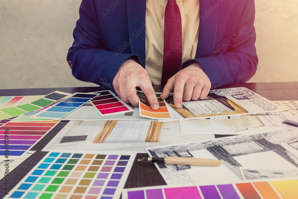 Home designer work at office house sketch with color catalog for dream ...