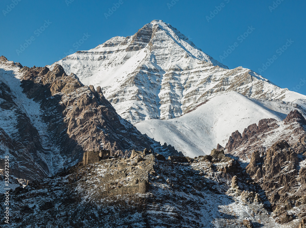 Snow-capped mountain over an ancient citadel on a ridge, Ladakh, Leh ...
