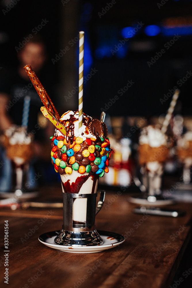 Extravagant and crazy milkshake with ice cream and chocolate topping ...