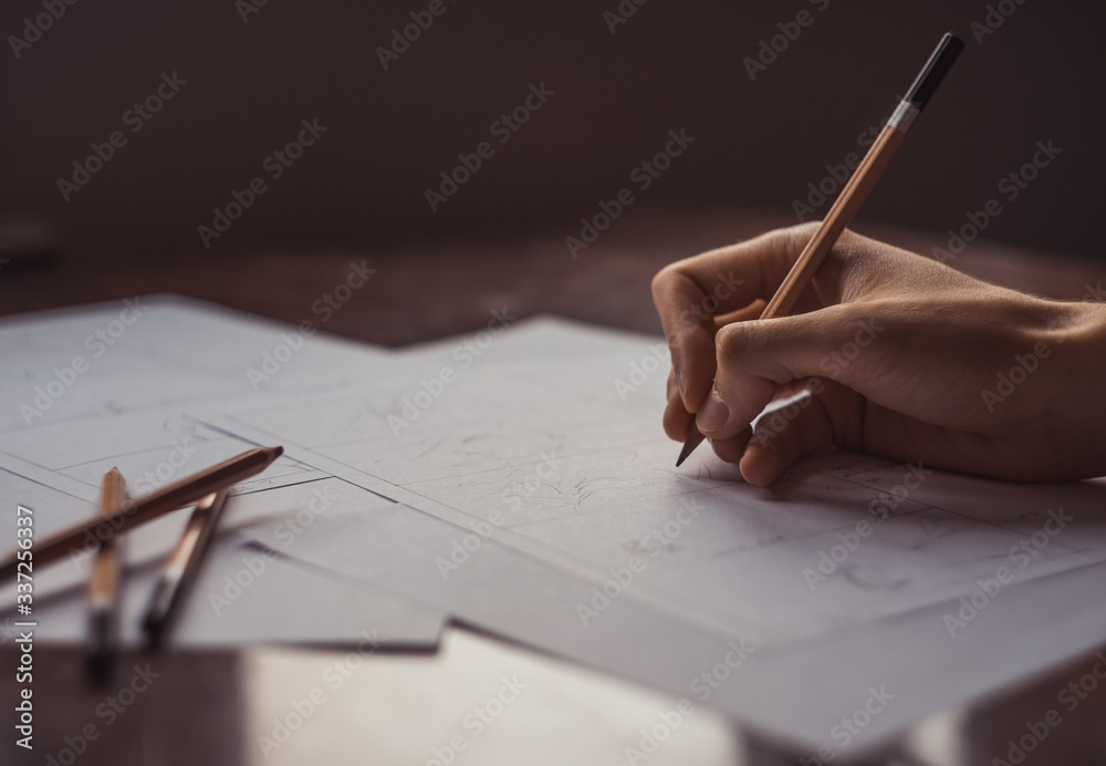 Hands draw a storyboard for the film indoors. Stock Photo | Adobe Stock